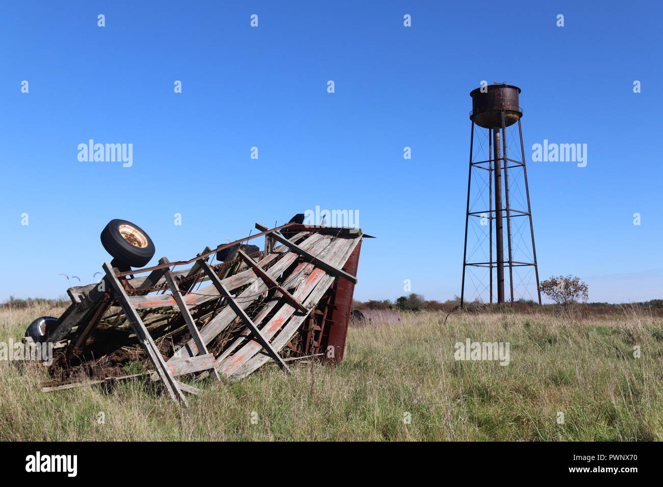 Water Tower Landscape with Abandoned Wagon Stock Photo - Alamy