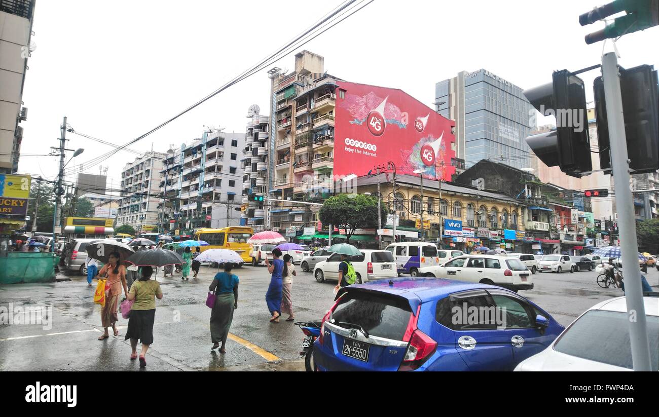 Yangon, Yangon Region, Myanmar. 9th Aug, 2018. Pedestrians are seen ...