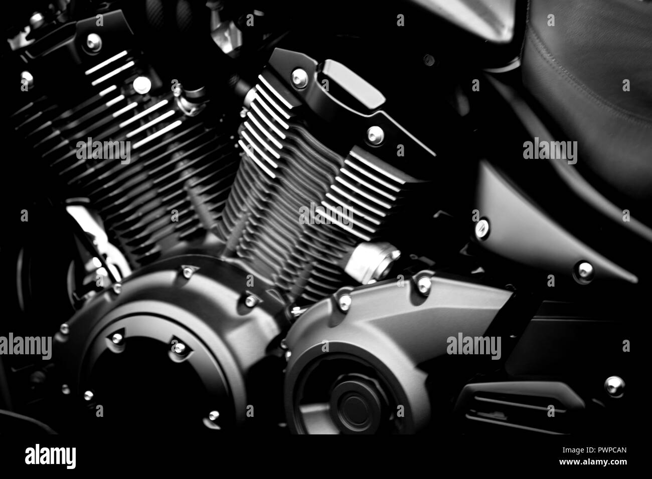 The close-up of a modern black painted engine block of a motorcycle ...