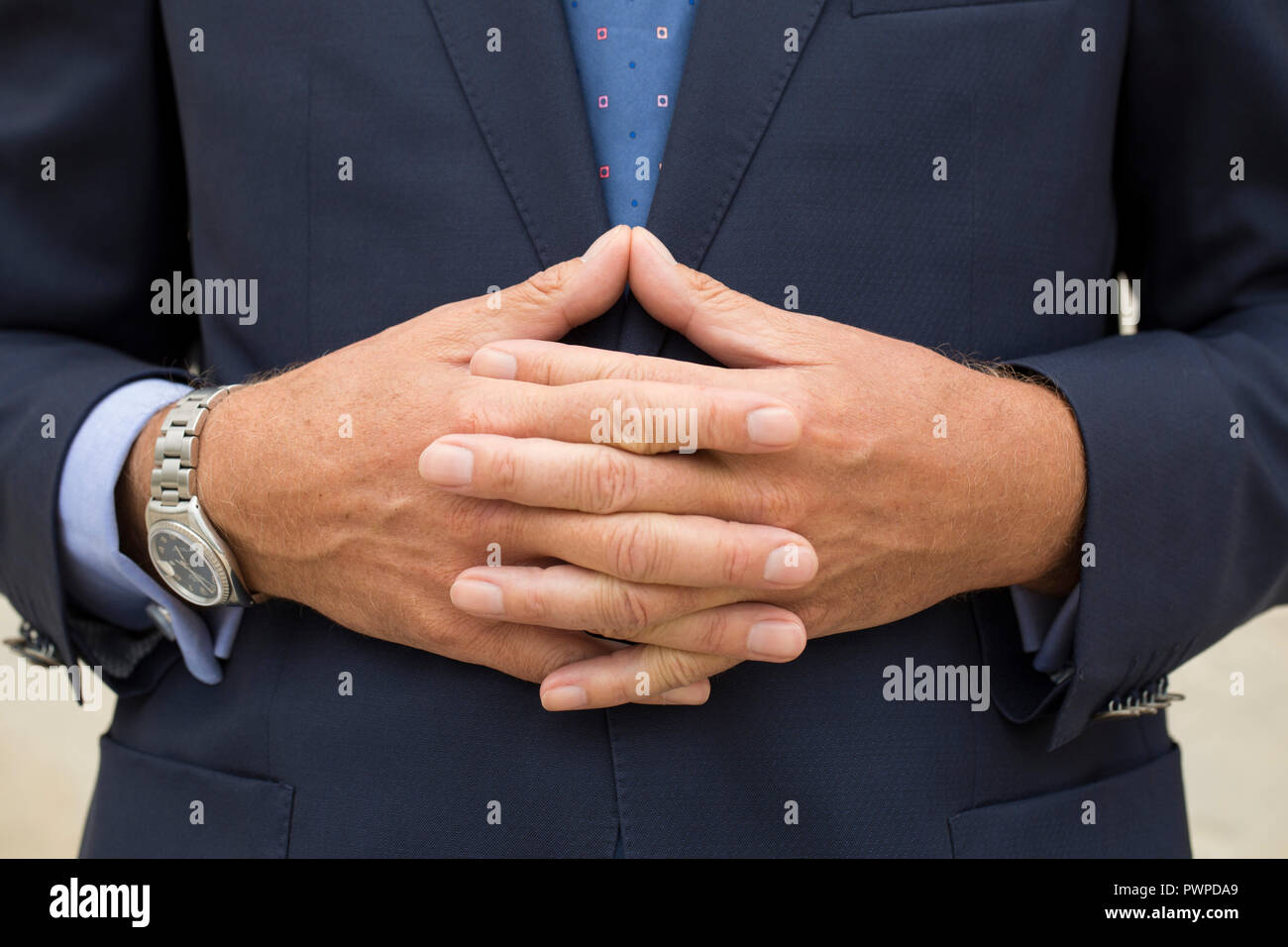 Close-up of man's hands in suit with fingers crossed in front Stock ...