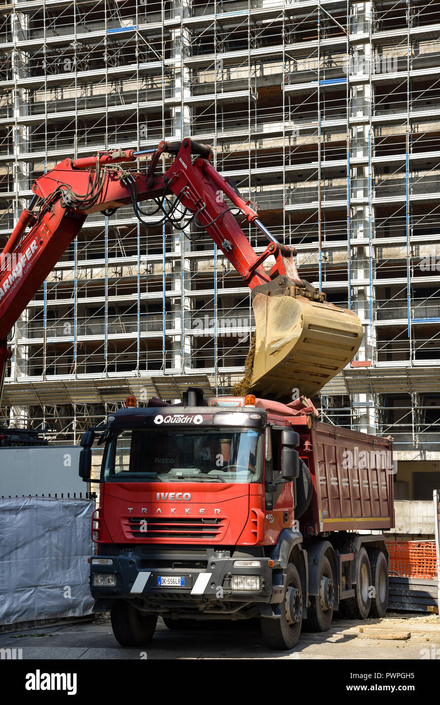 Milan,Italy - May 24 2018: Modern excavator performs excavation work ...