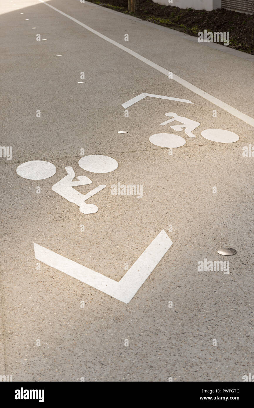 Signs on the ground of the pavement for bikes in a new area Stock Photo ...