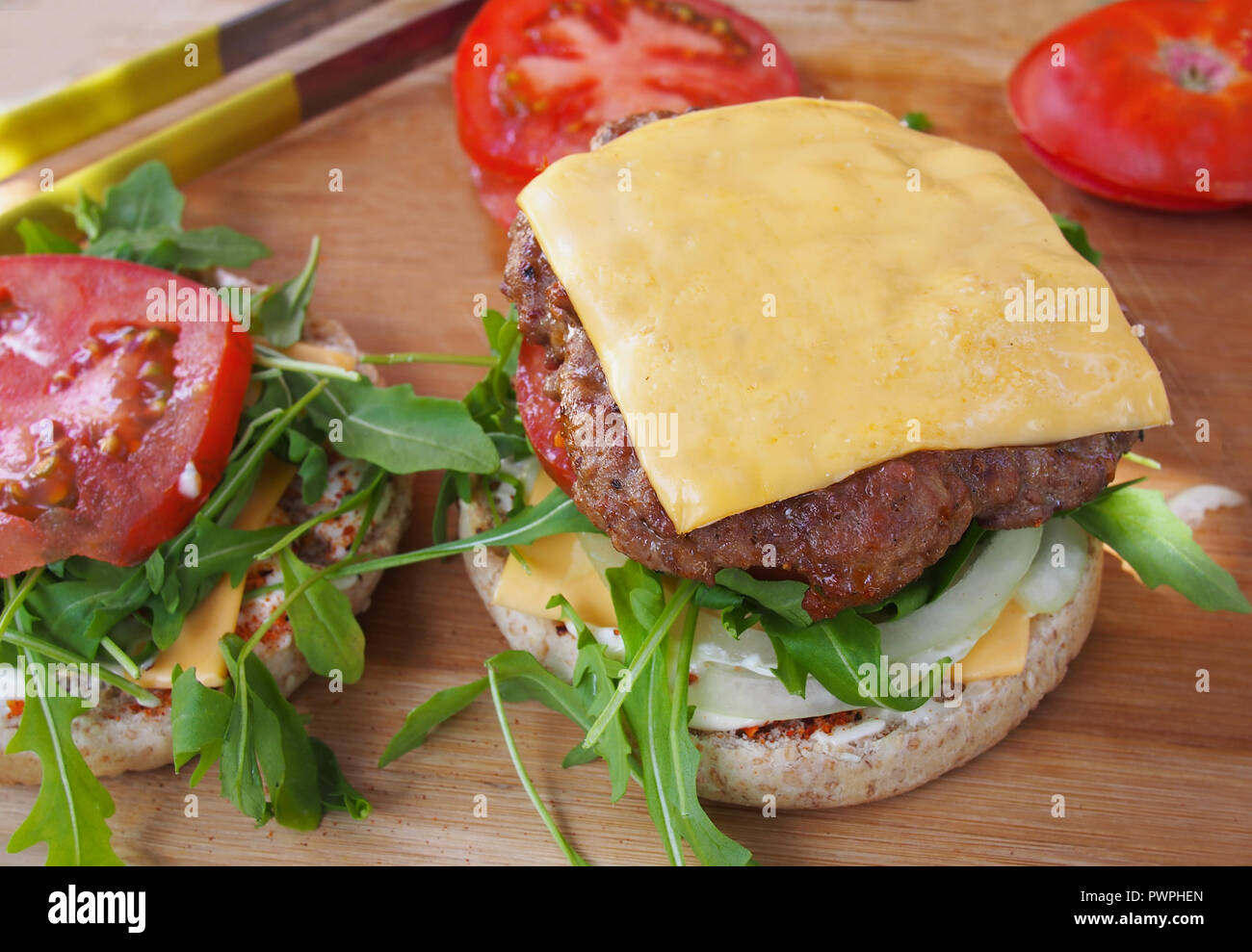 Young man eating a hamburger, Juicy and yummy hamburger Stock Photo - Alamy