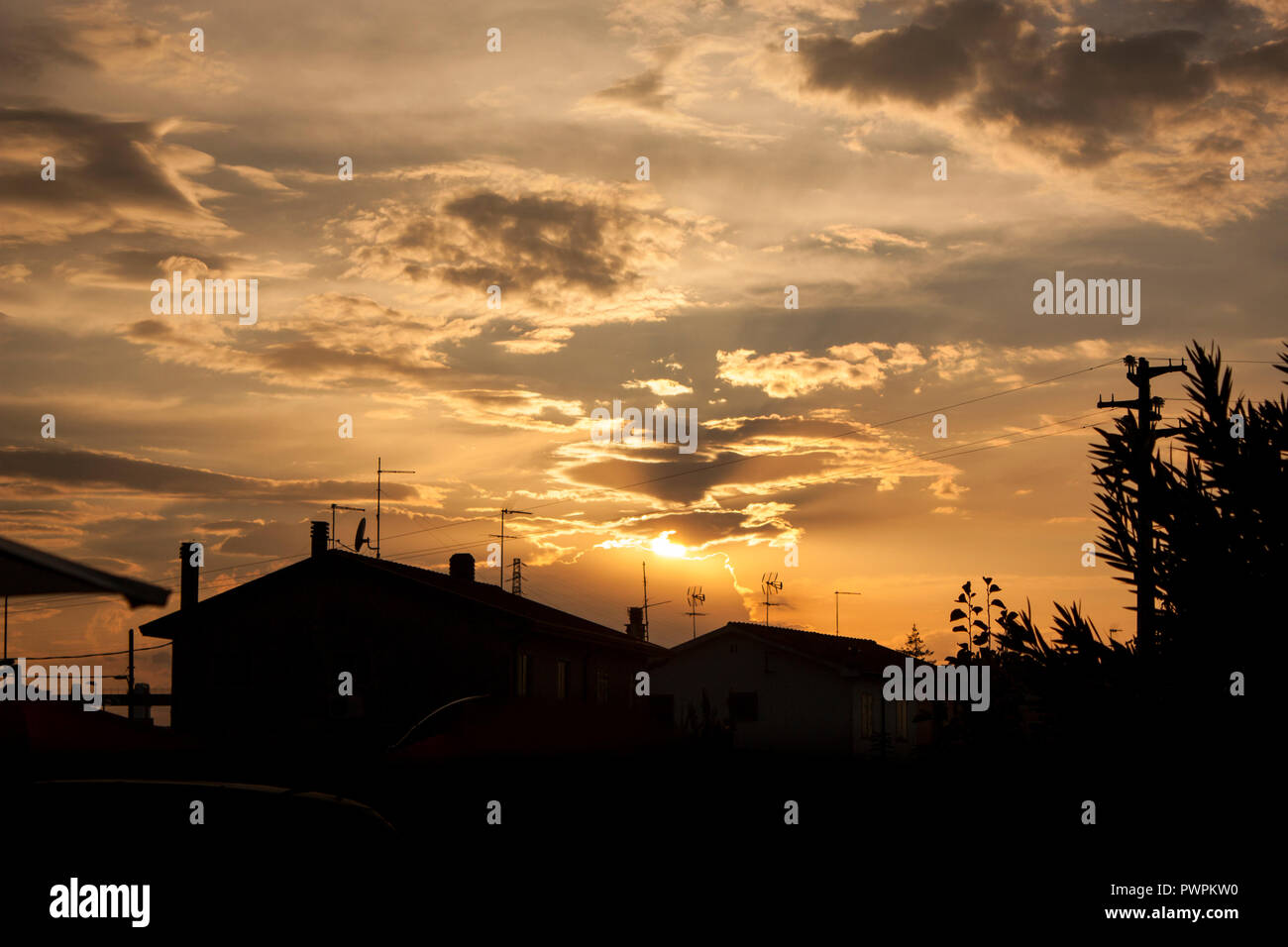 Sunset in a small Italian village, and highlight the silhouette of ...
