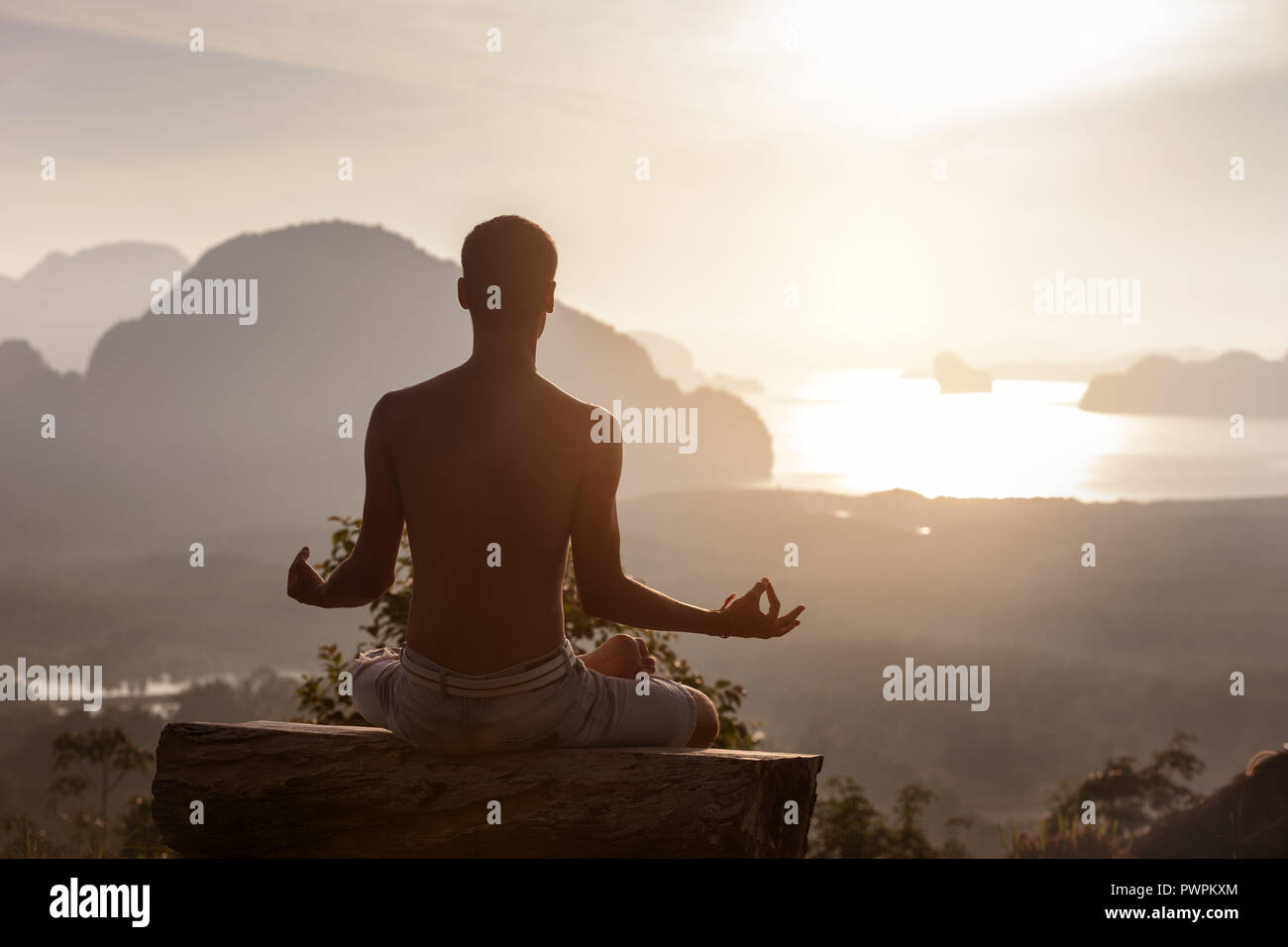 Meditating man silhouette hi-res stock photography and images - Alamy