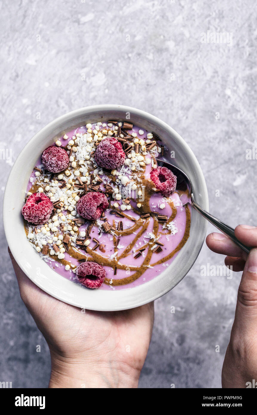 Vegan raspberry yogurt bowl Stock Photo - Alamy