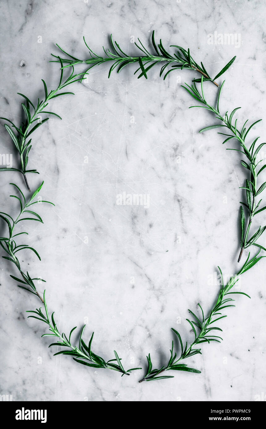 Rosemary frame on marble background Stock Photo - Alamy