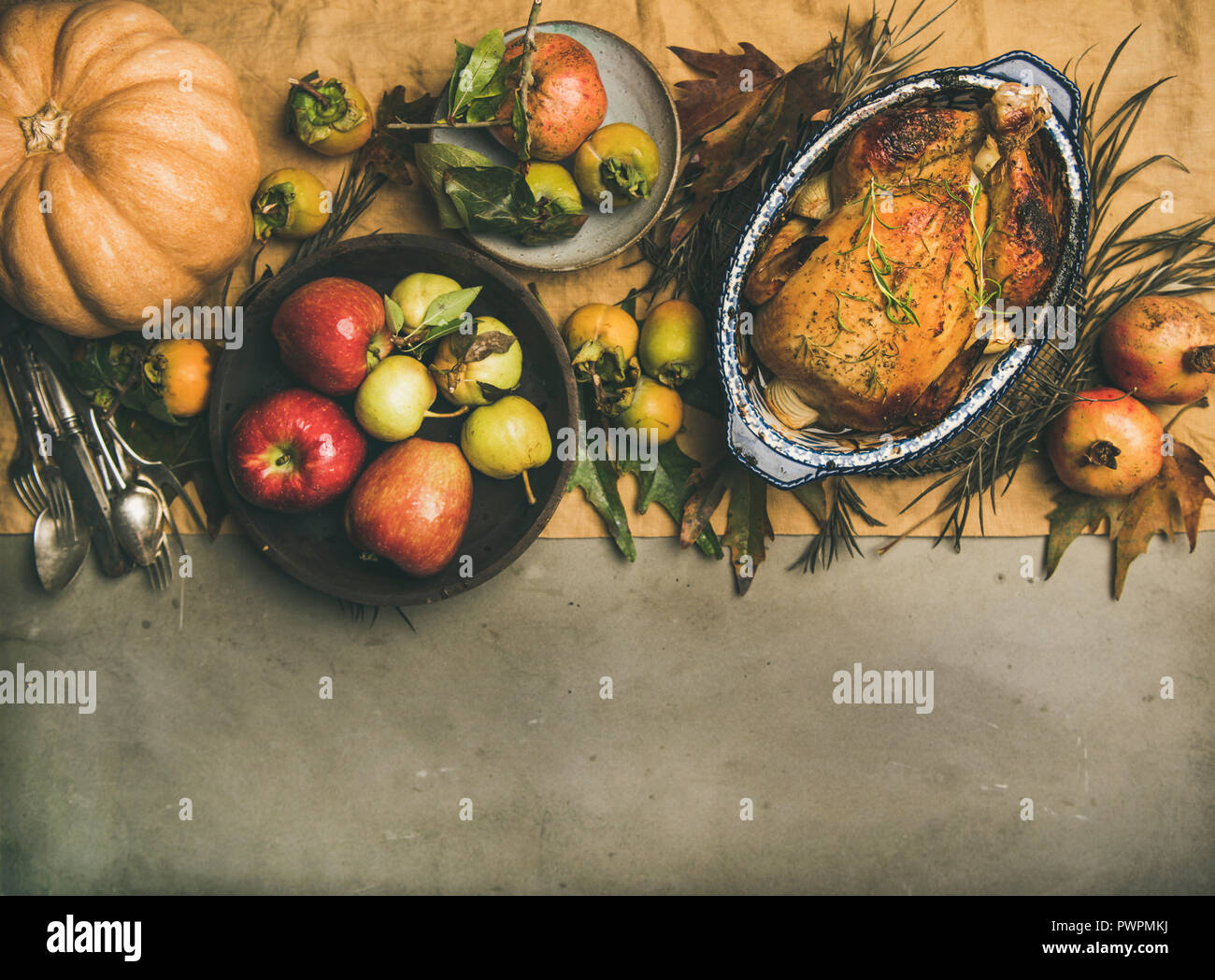 Thanksgiving dinner table. Flat-lay of roasted chicken or turkey ...