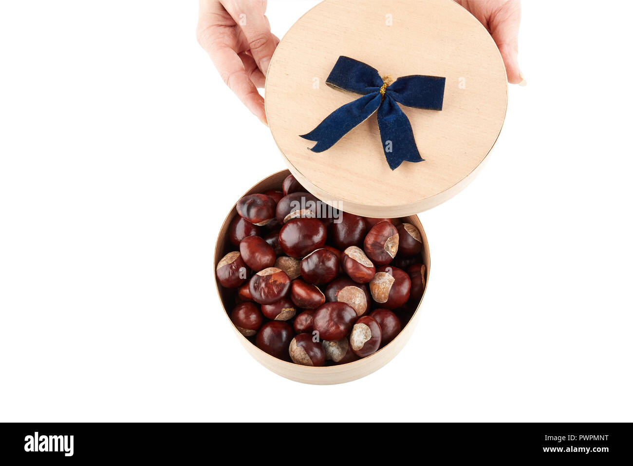 Chestnuts in round wooden box. Isolated on white background Stock Photo ...