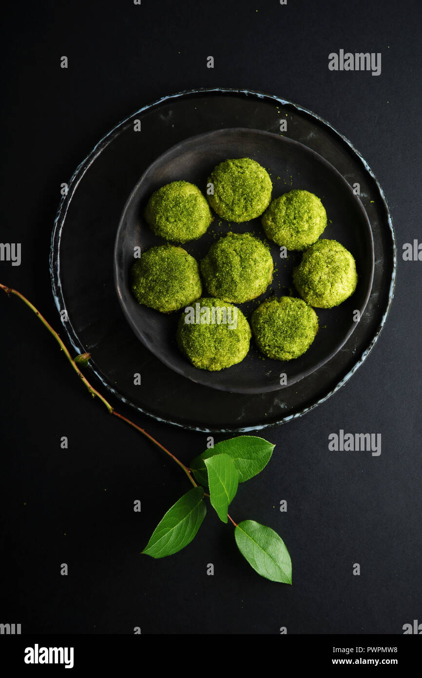 Overhead image of matcha cookies covered with sugar and matcha powder ...