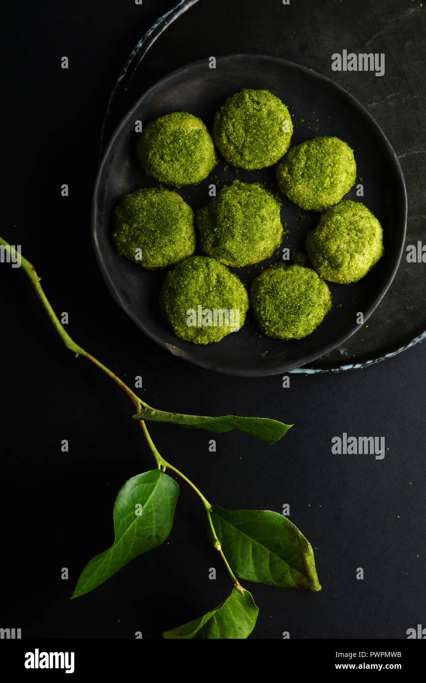 Overhead image of matcha cookies covered with sugar and matcha powder ...