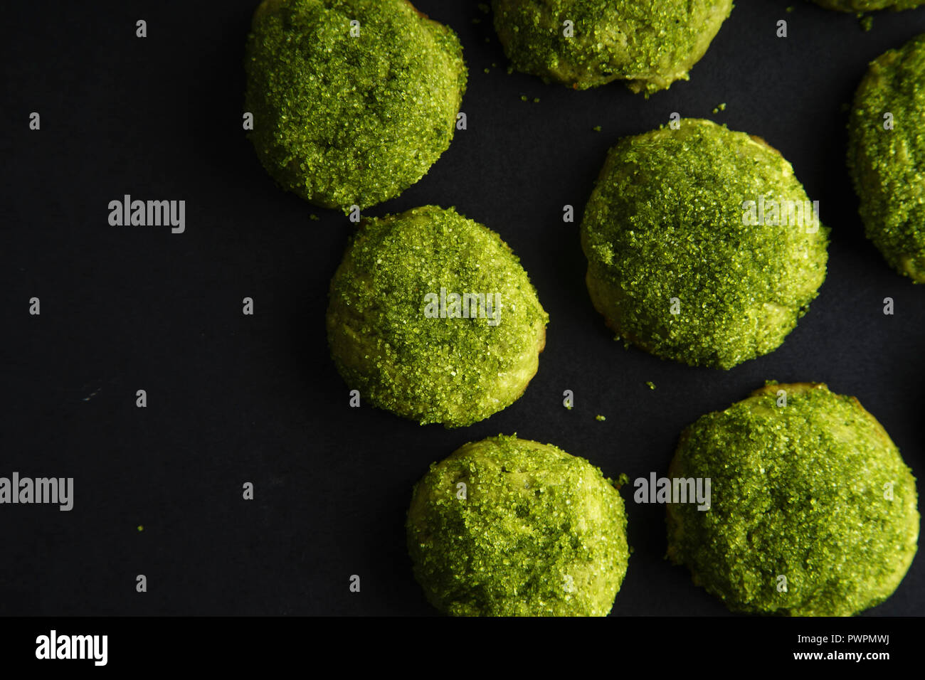 Overhead image of matcha cookies covered with sugar and matcha powder ...