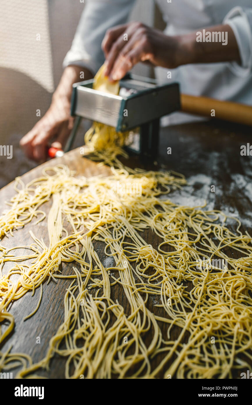 A WOMAN MAKING HOMEMADE PASTA IN THE TRADITIONAL WAY Stock Photo - Alamy