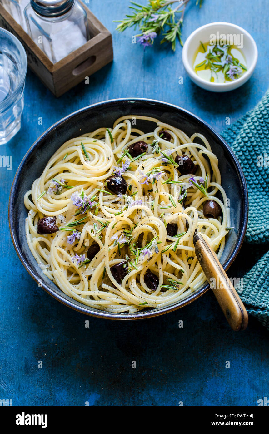 Spaghetti with onions rosemary and black olives Stock Photo - Alamy
