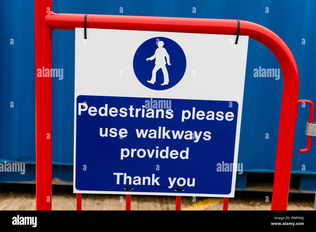 Pedestrians please use walkways provided sign Stock Photo - Alamy