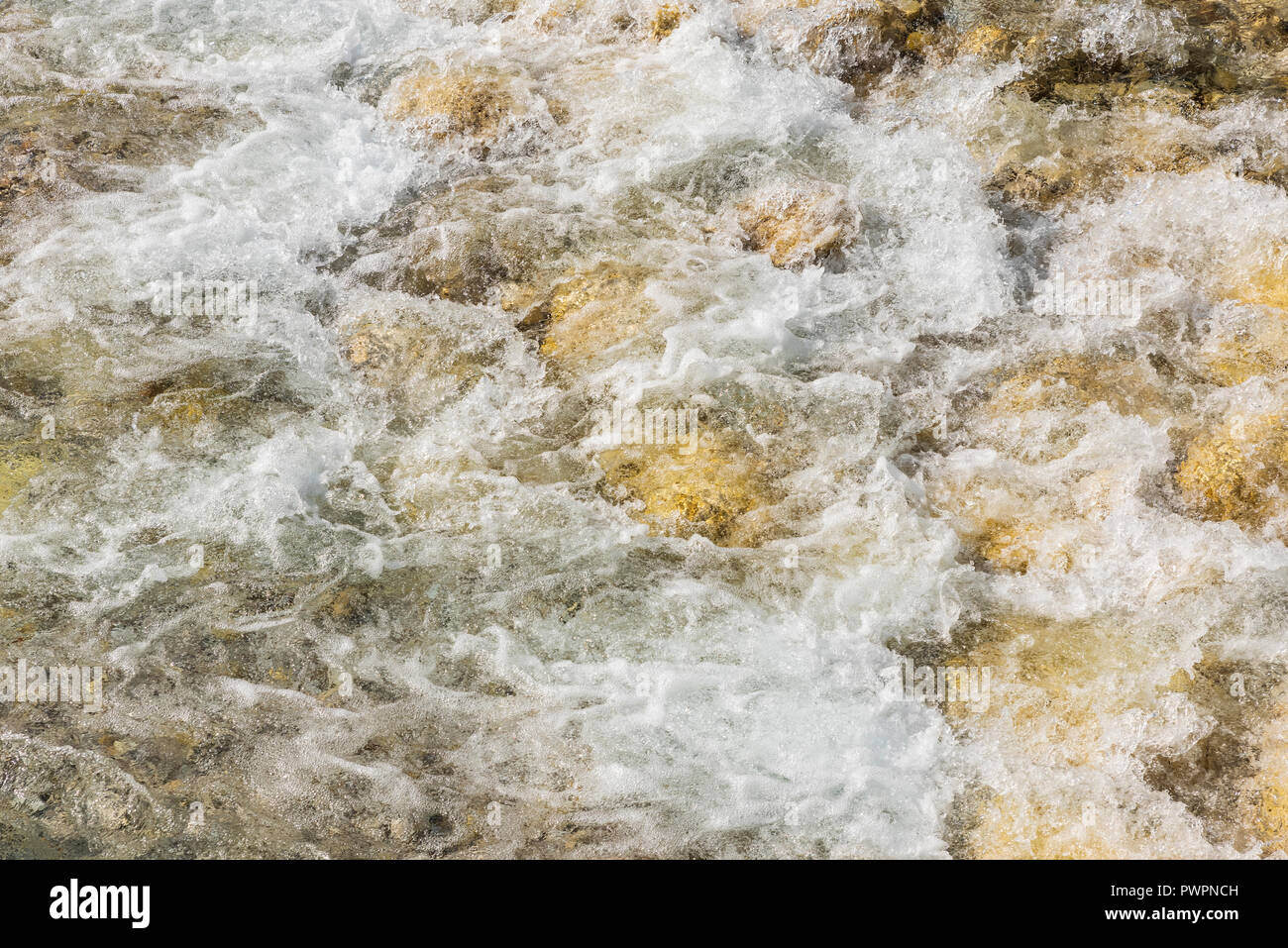 Water bubbling between rocks in mountain stream Stock Photo - Alamy