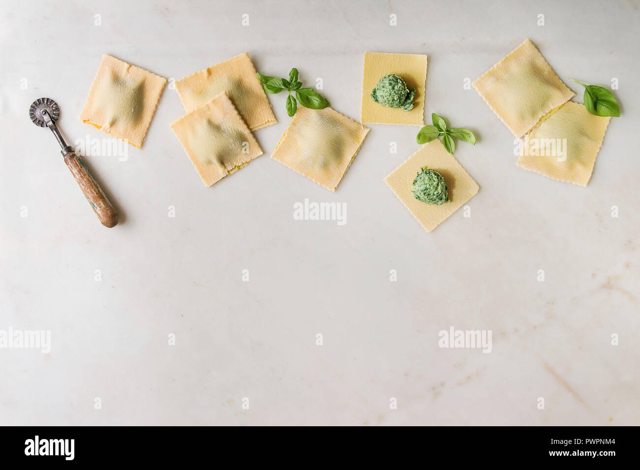Homemade raw uncooked italian pasta ravioli staffed by spinach ricotta ...