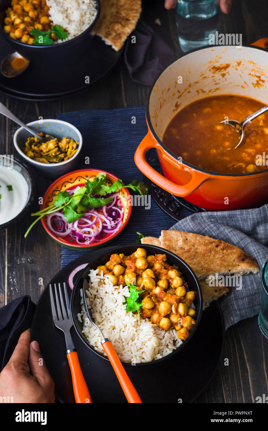 Chickpeas Curry served with Rice and Naan Bread Stock Photo - Alamy