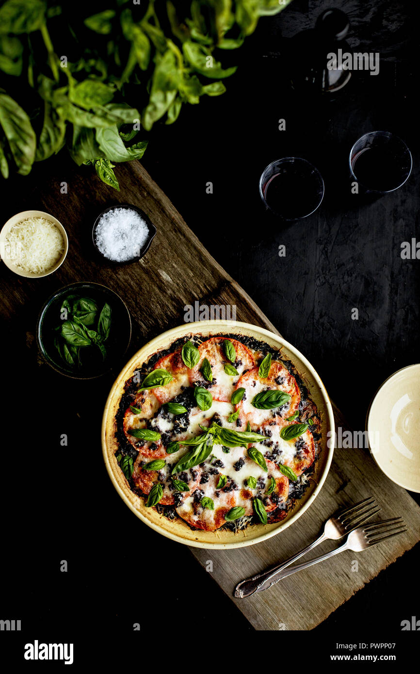 Caprese Black Rice Casserole served in a ceramic bowl. Photographed on ...