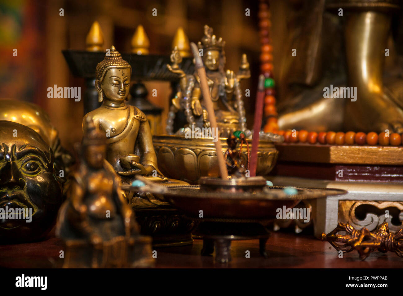 Oriental culture: Set of statues of Buddha and many other symbols of ...