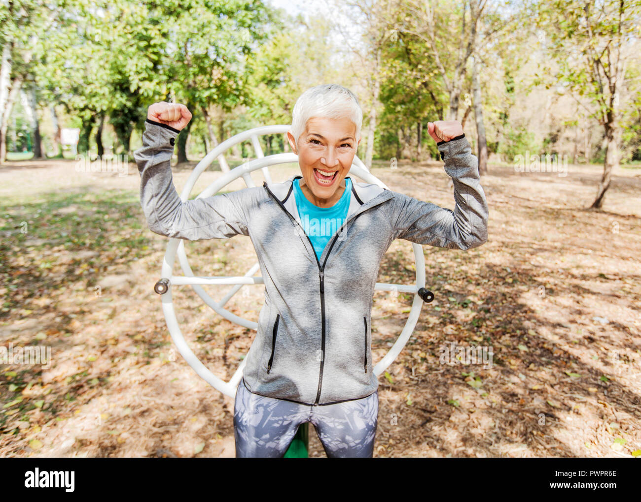 Happy Fit Successful Senior Woman Raised Arms At Outdoor Gym. Shows ...