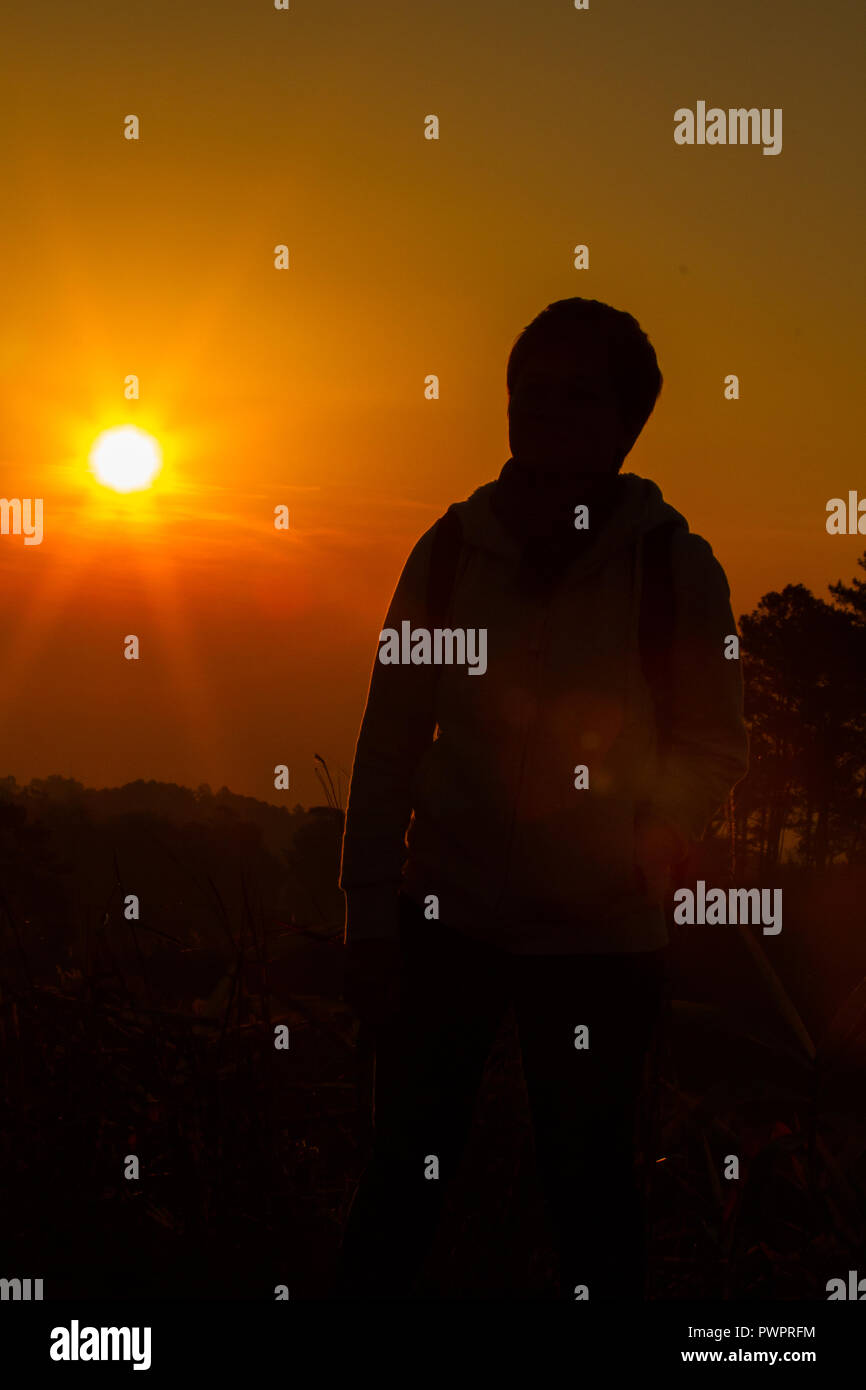 silhouette of a man and beautiful sunset background Stock Photo - Alamy