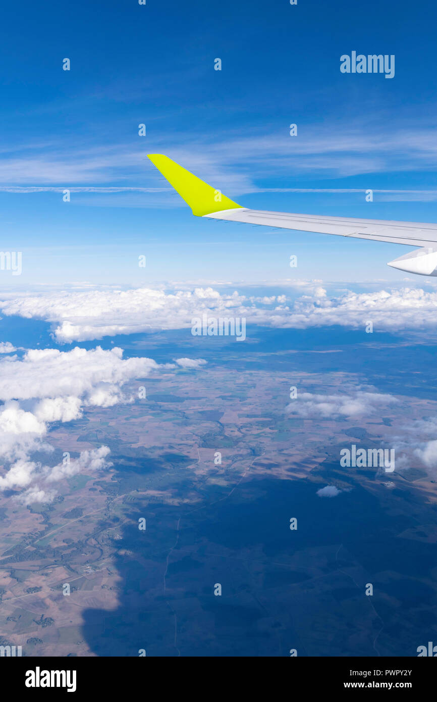 Classic image through aircraft window onto jet engine, wing of airplane ...