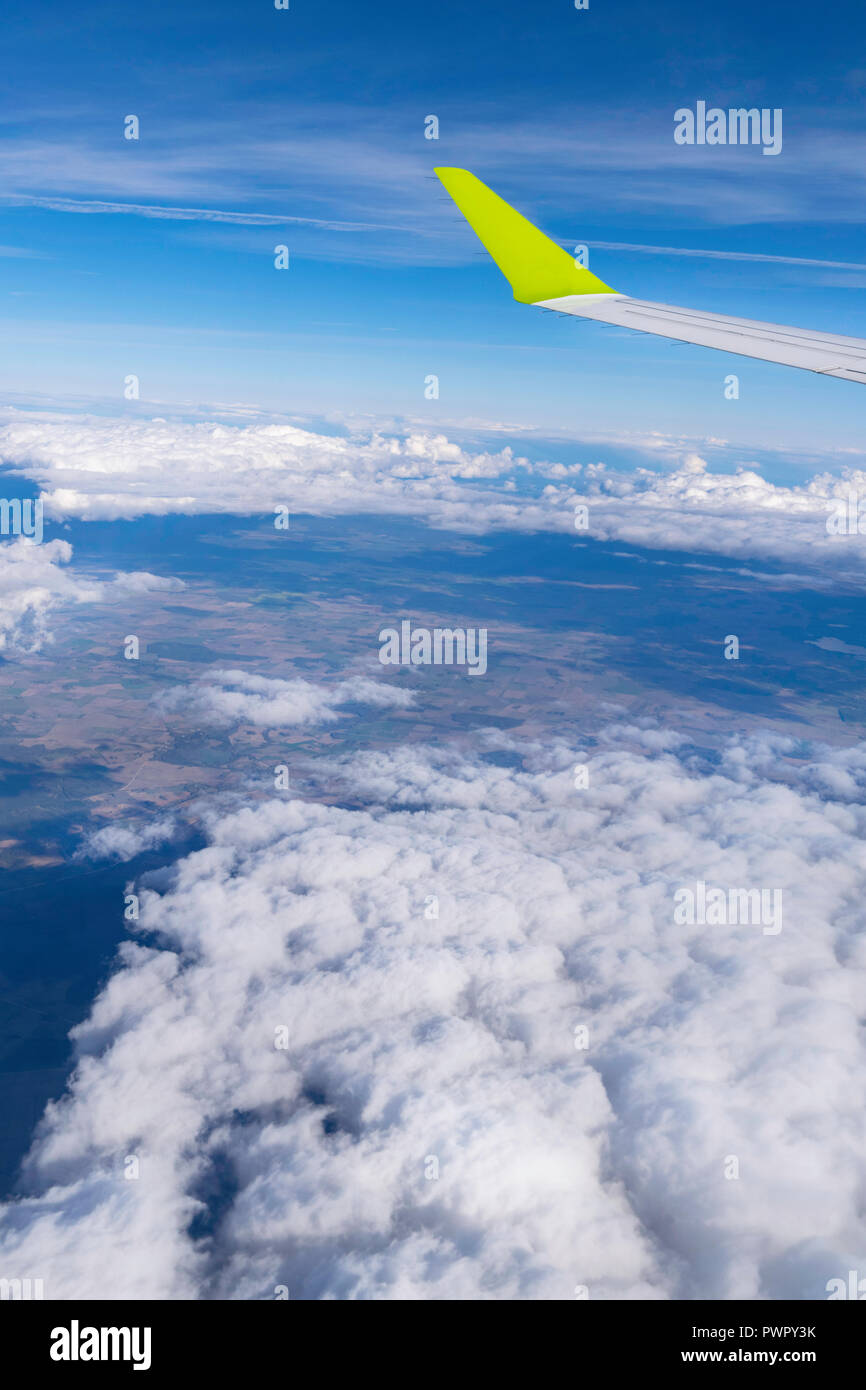 Classic image through aircraft window onto jet engine, wing of airplane ...