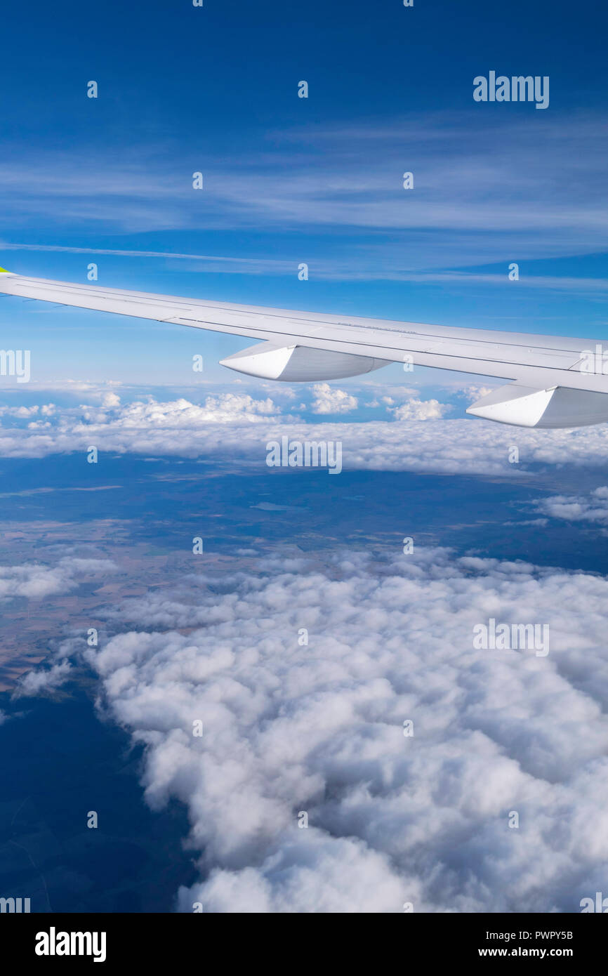 Classic image through aircraft window onto jet engine, wing of airplane ...