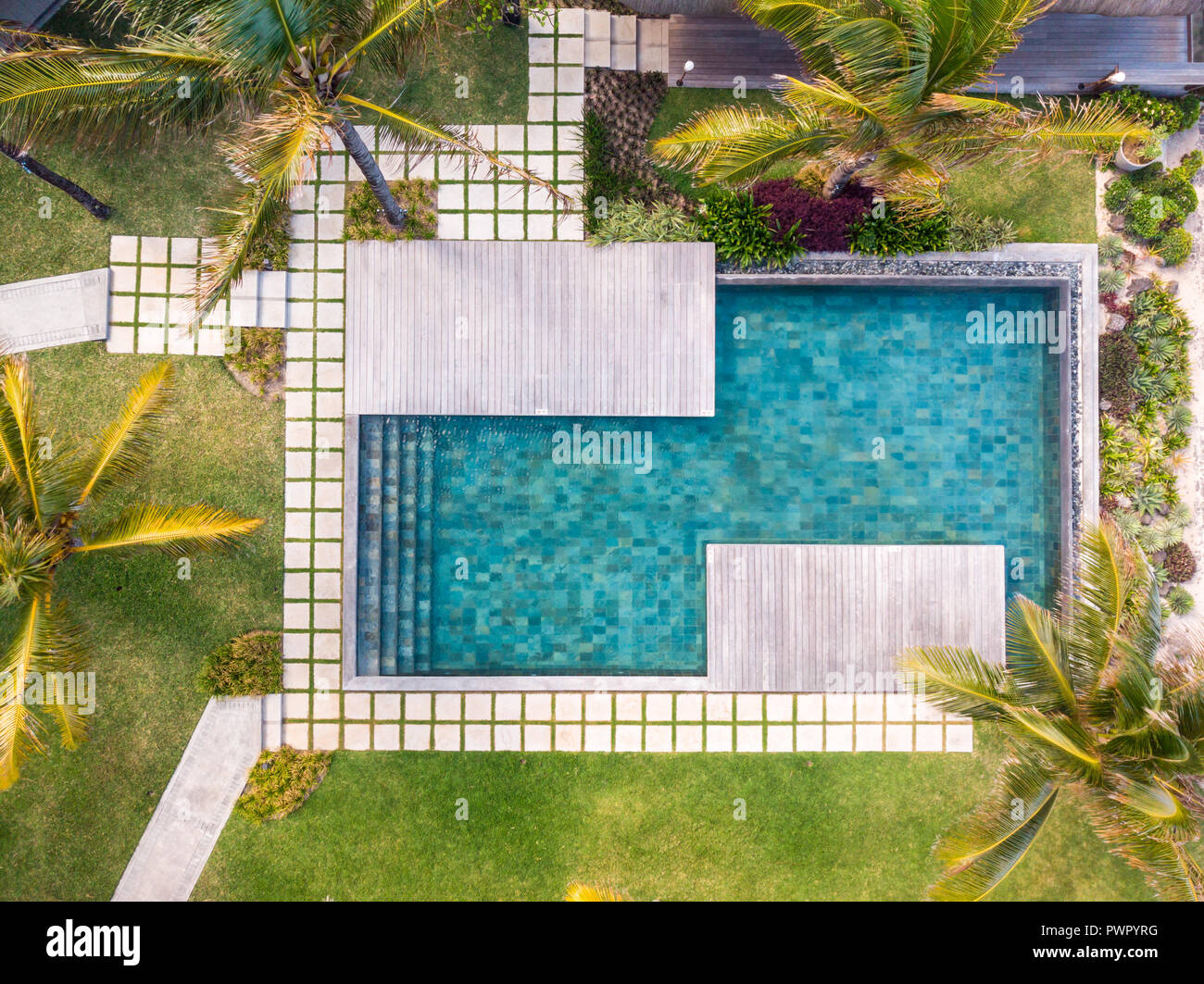 Aerial view of luxury hotel resort with swimming pool with stair and ...