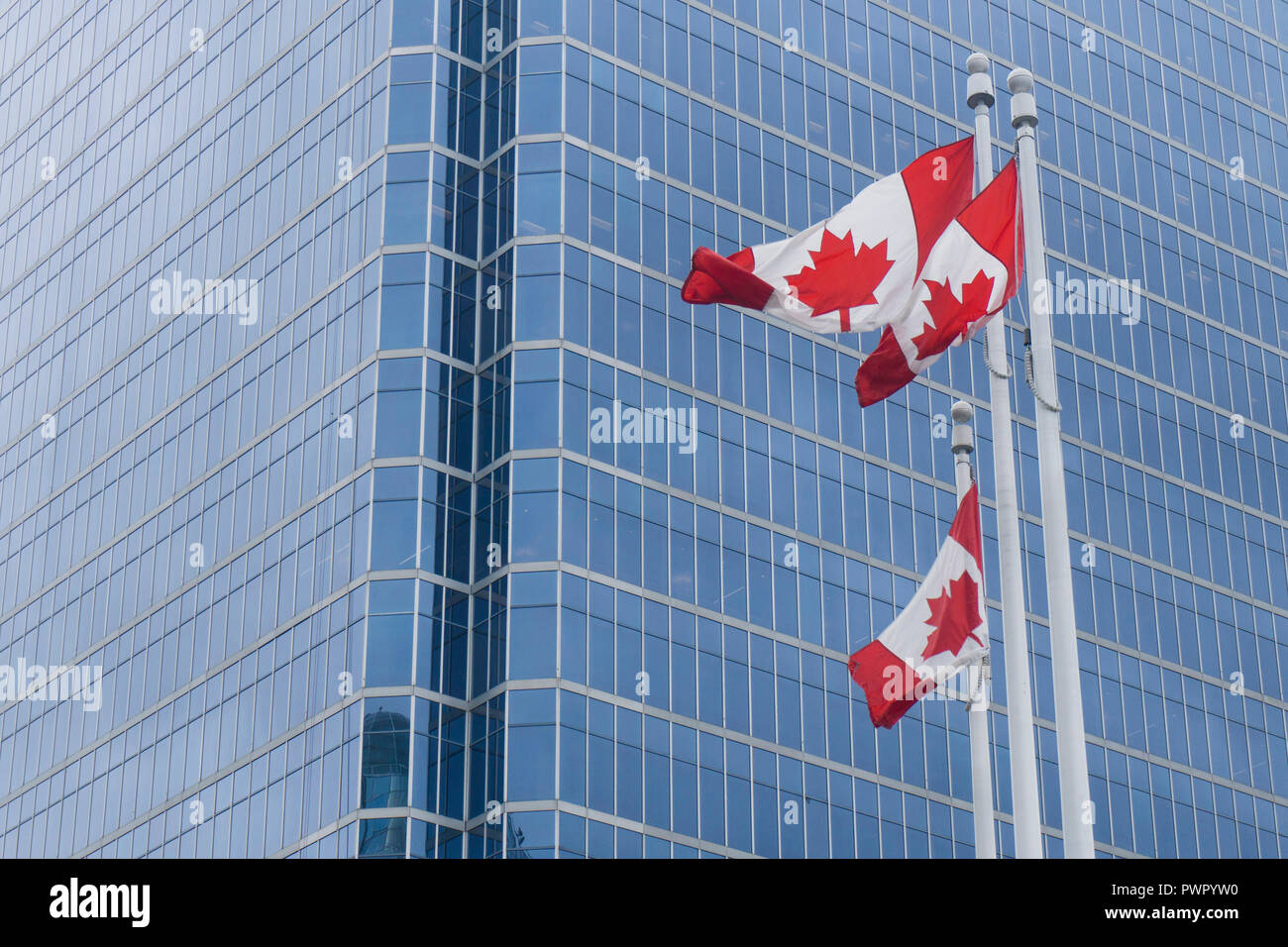 Canadian flag infront of modern glass building in Vancouver Stock Photo ...