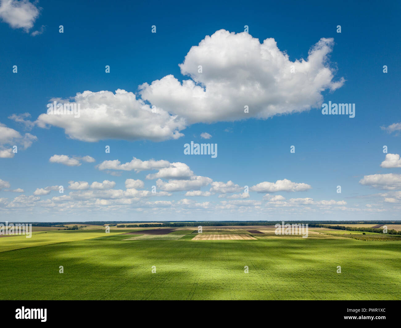 Beautiful rural lanscape with blue sky and white clouds, agricultural ...