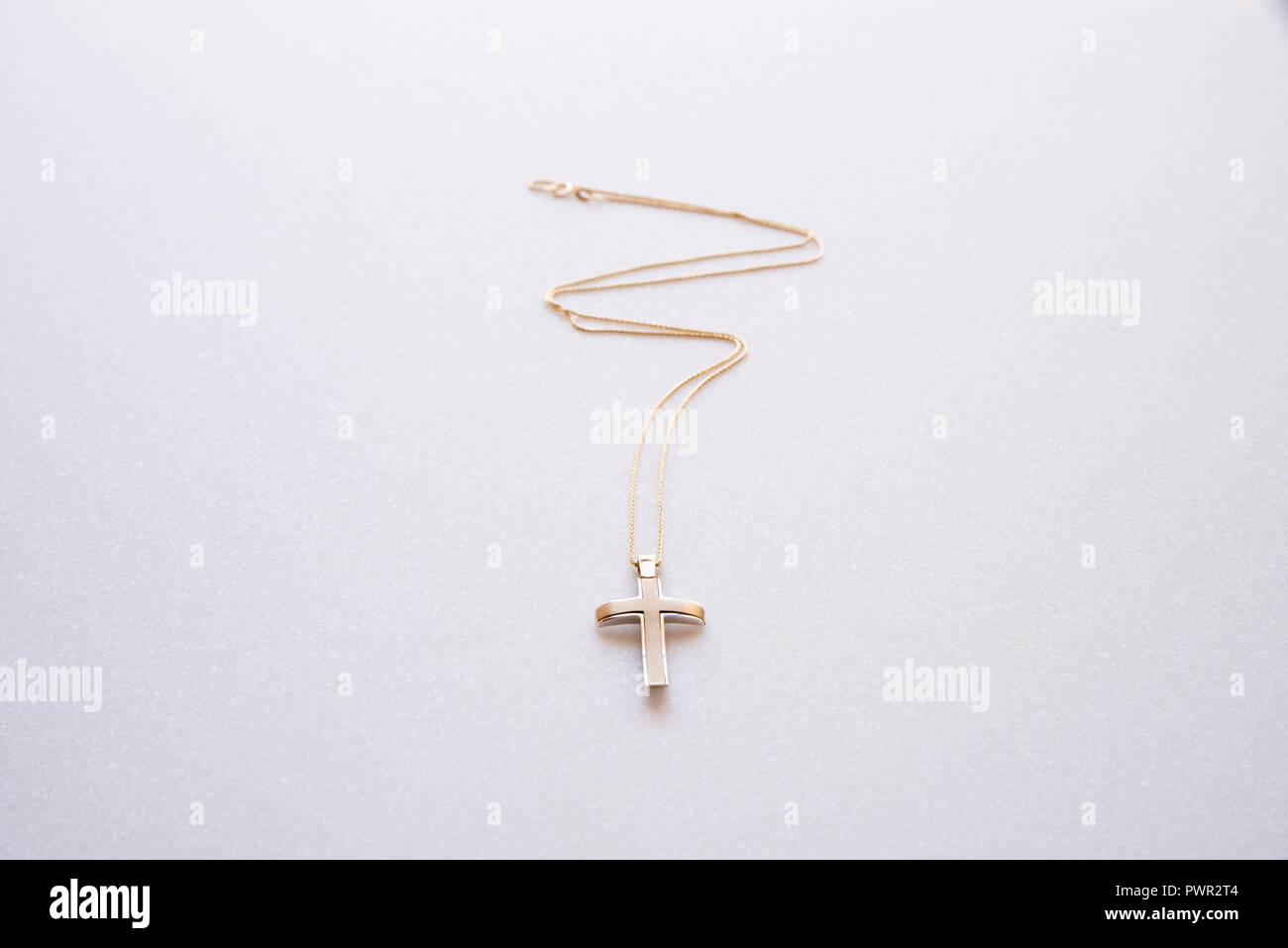 Christian cross and gold chain isolated on a white background Stock ...