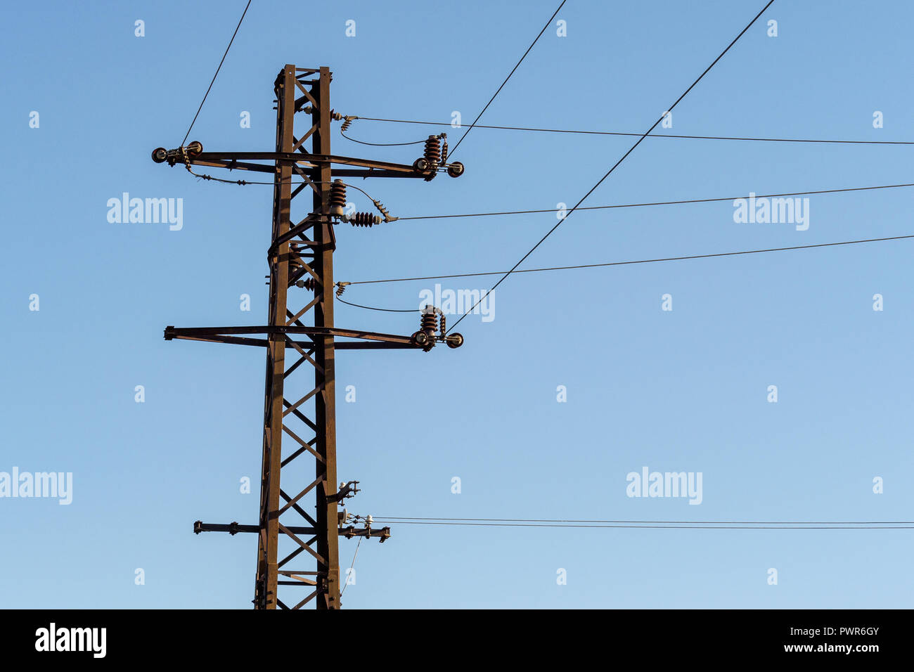 Electric column and wires of high voltage on blue sky background Stock ...