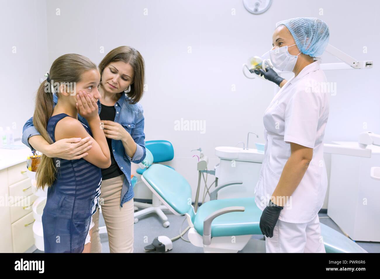 Mother and little daughter visiting pediatric dentist at dental clinics ...