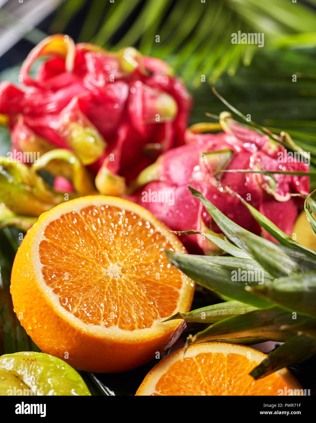 Close-up of exotic background from fresh ripe tropical fruits dragon ...