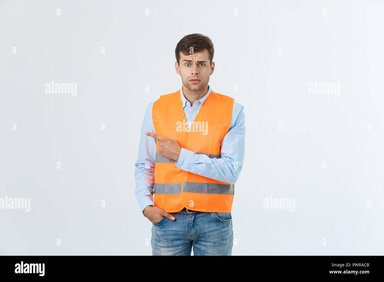 Young workman annoyed angry in furious gesture. Negative expression on ...