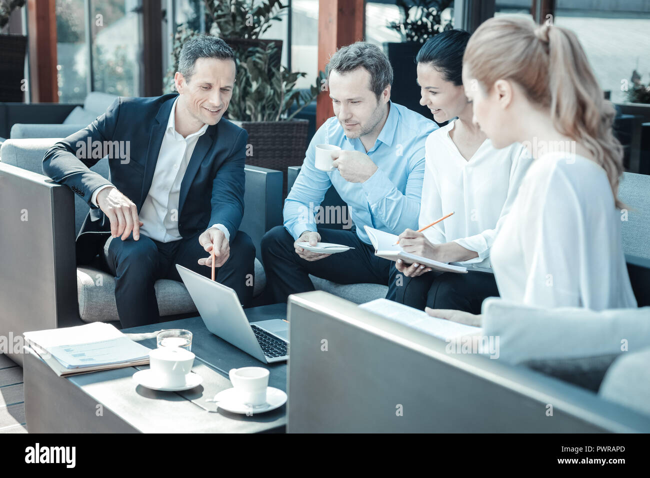 Handsome male person explaining his idea Stock Photo - Alamy