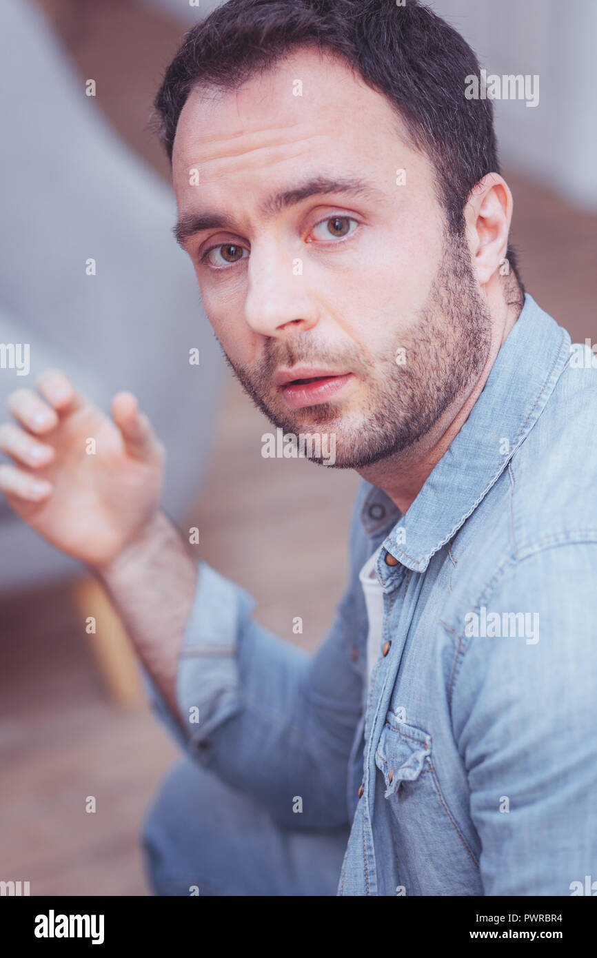 Portrait of puzzled bearded man Stock Photo - Alamy