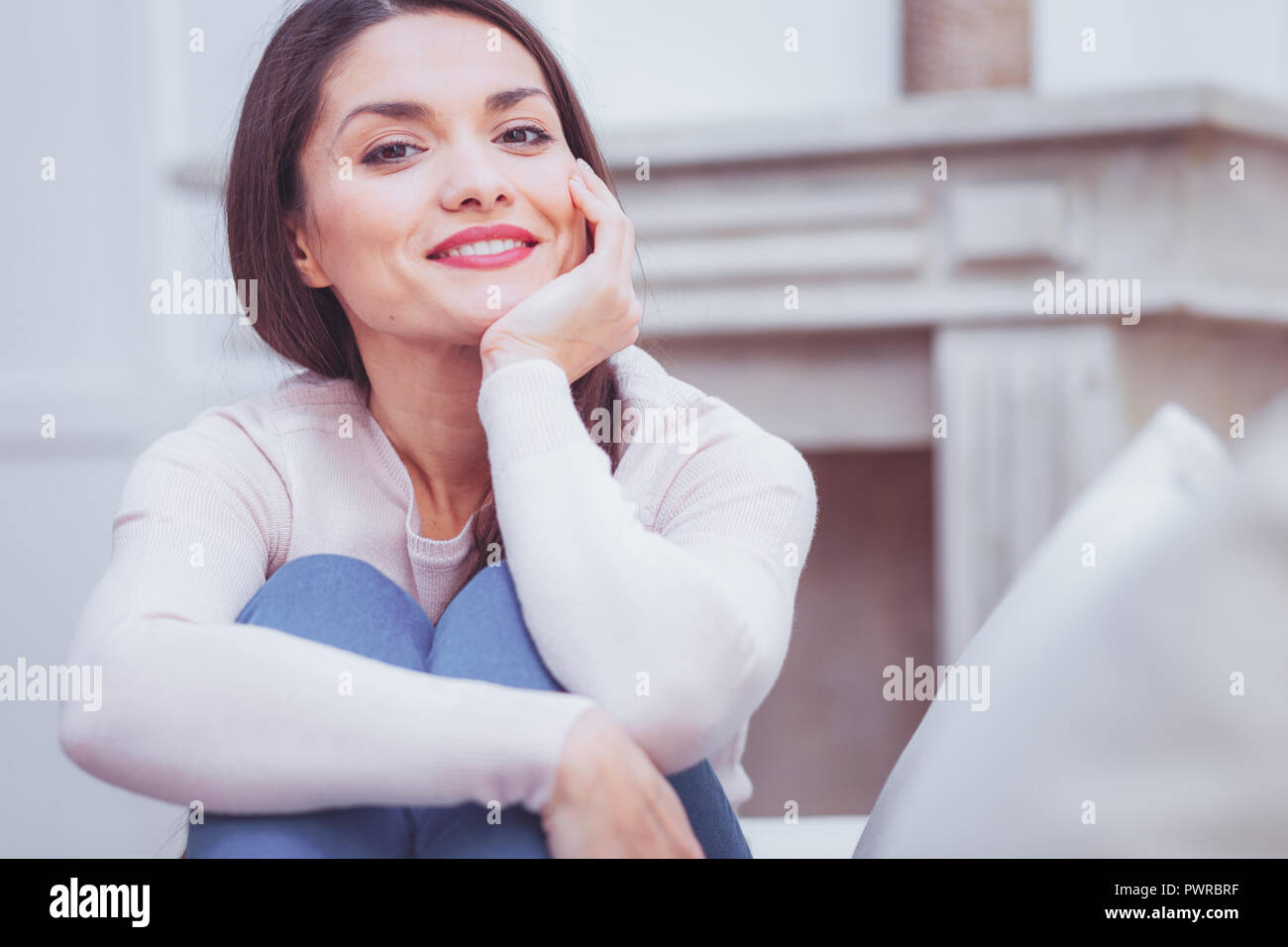 Charming dreamy woman propping her chin on hand Stock Photo - Alamy