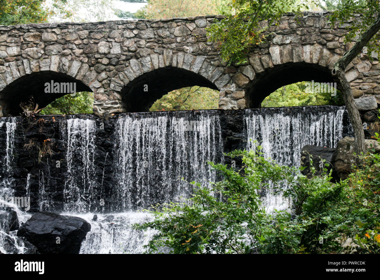 Bridge with waterfall Stock Photo - Alamy