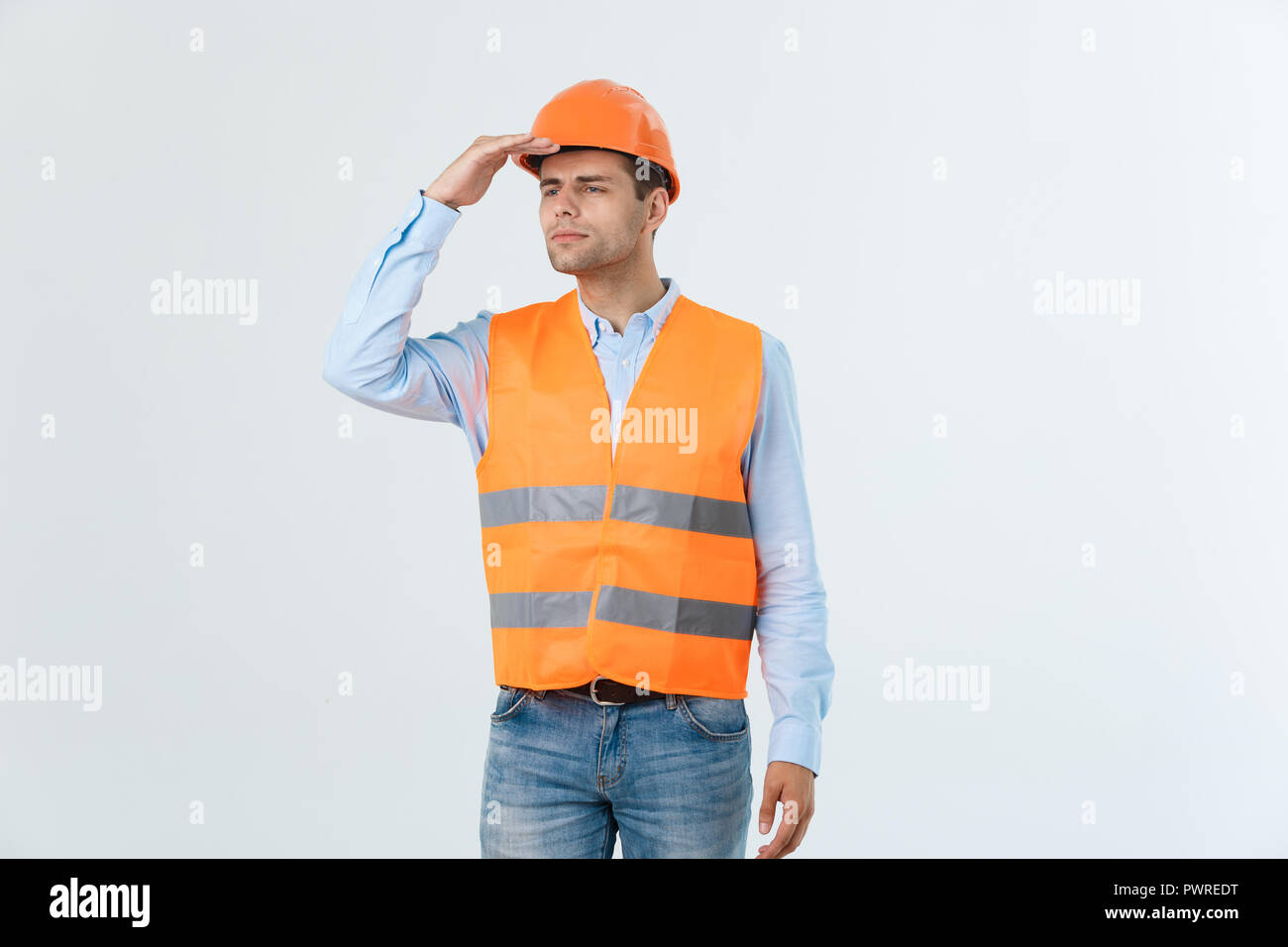 engineer in a helmet looks to the side view side view Stock Photo - Alamy