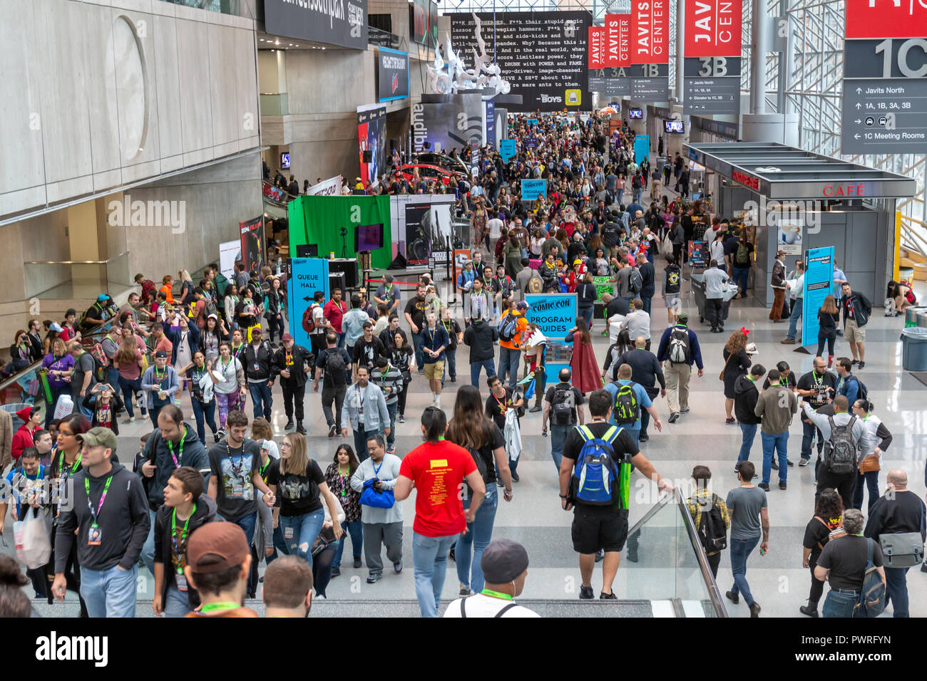 A crowd of visitors and fans to the New York Comic Con comic book and ...