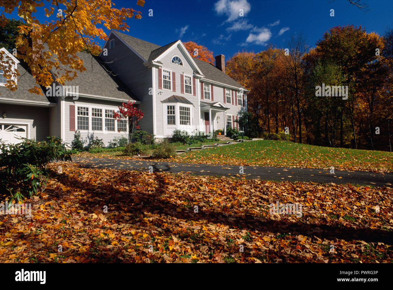 Large suburban home in the Northeast with fall foliage, Connecticut ...
