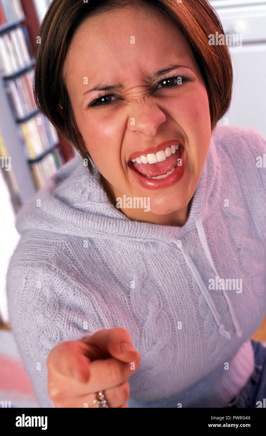 Angry young woman pointing finger, USA Stock Photo - Alamy