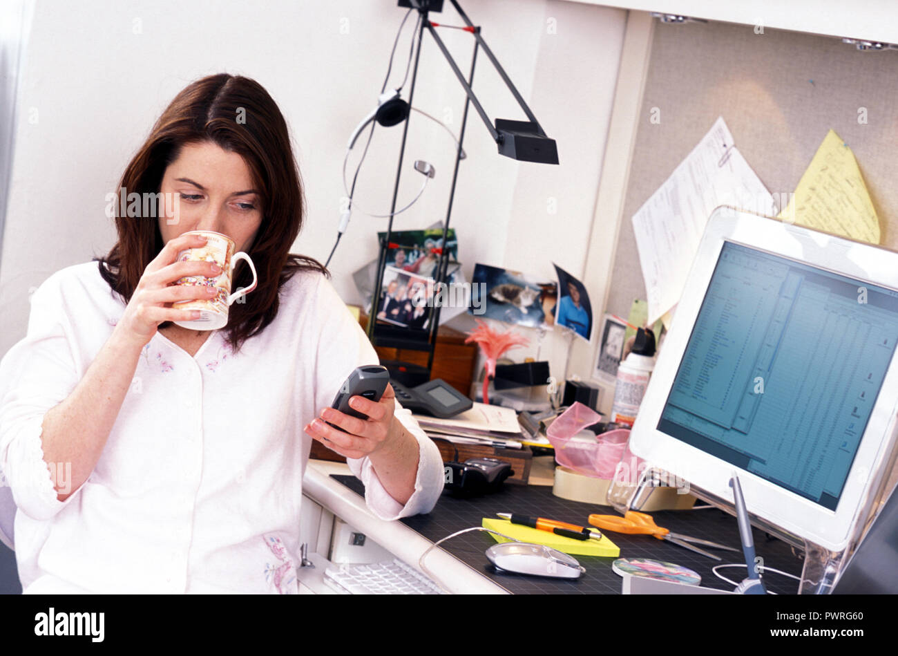 Caucasian young woman working in home office in pajamas, USA Stock ...