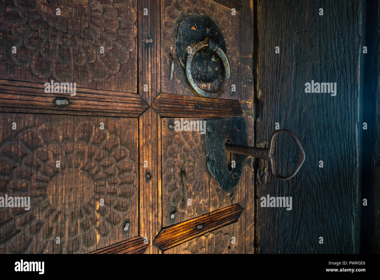 Big key in rustic door of wooden church Stock Photo - Alamy