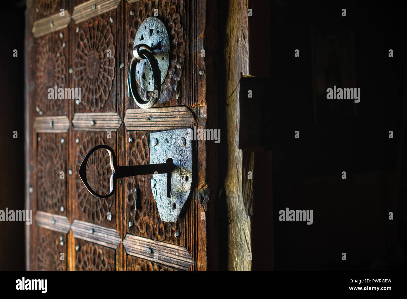 Big key in rustic door of wooden church Stock Photo - Alamy