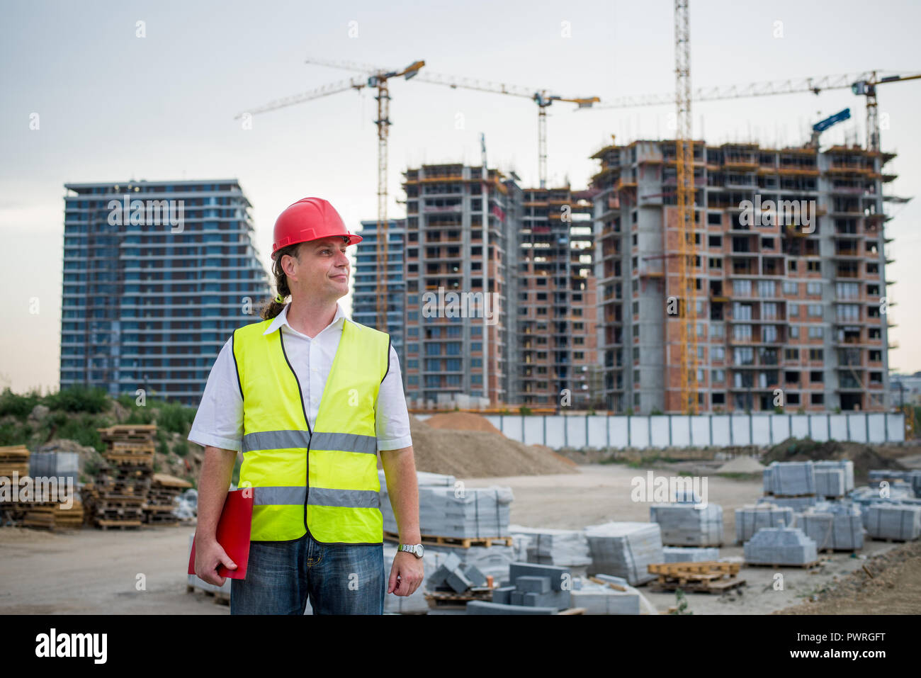 Engineer on a construction site working on housing project Stock Photo ...