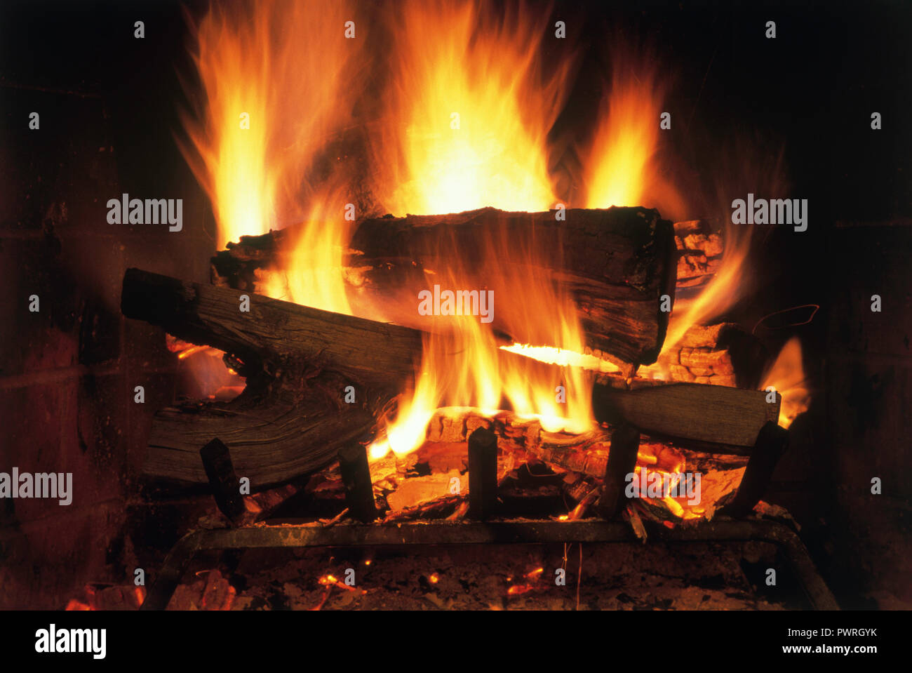 Natural log fire in residential fireplace, USA Stock Photo - Alamy